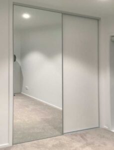 Silver mirror sliding door with double tracks ‣ NOVA INTERIOR